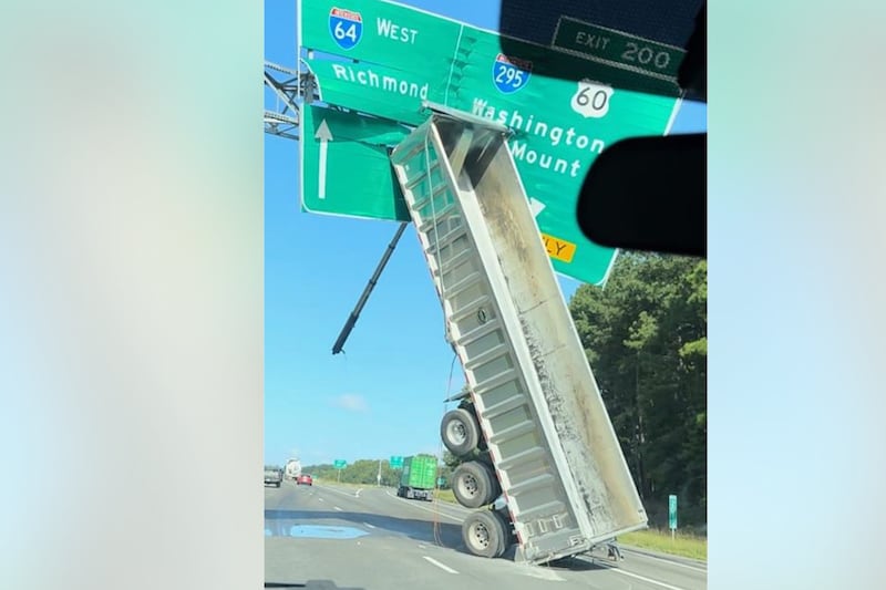 Tractor-trailer driver charged after crash shuts down part of I-64 Tractor-trailer driver charged after crash shuts down part of I-64